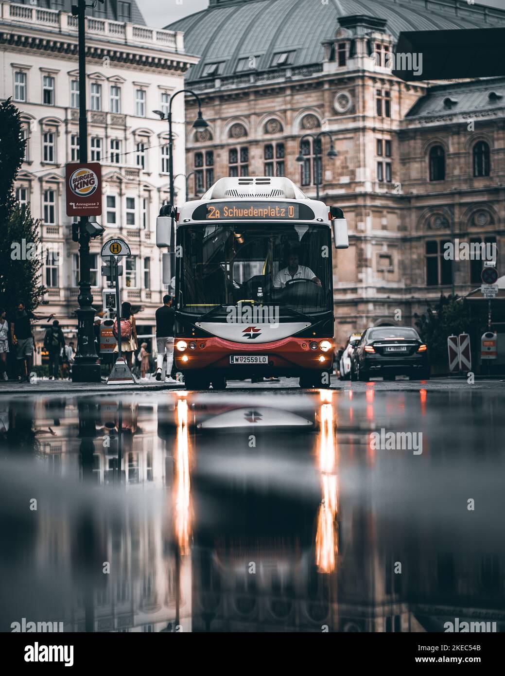 A Bus driving in street of Vienna City to Schwedenplatz and the ground ...