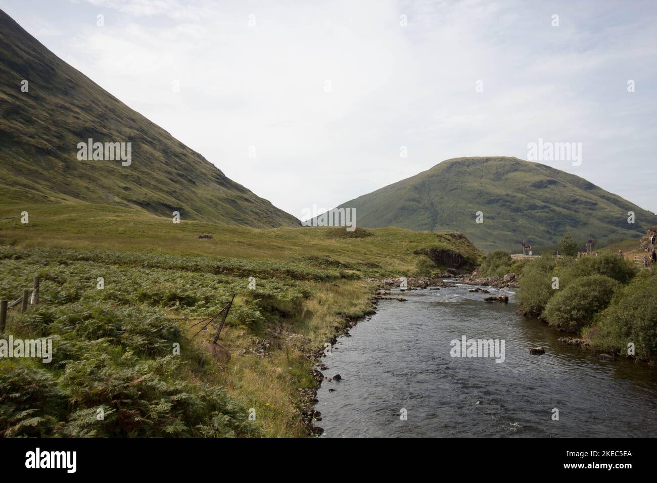 A scenic view of a river flowing through the valley with green ...