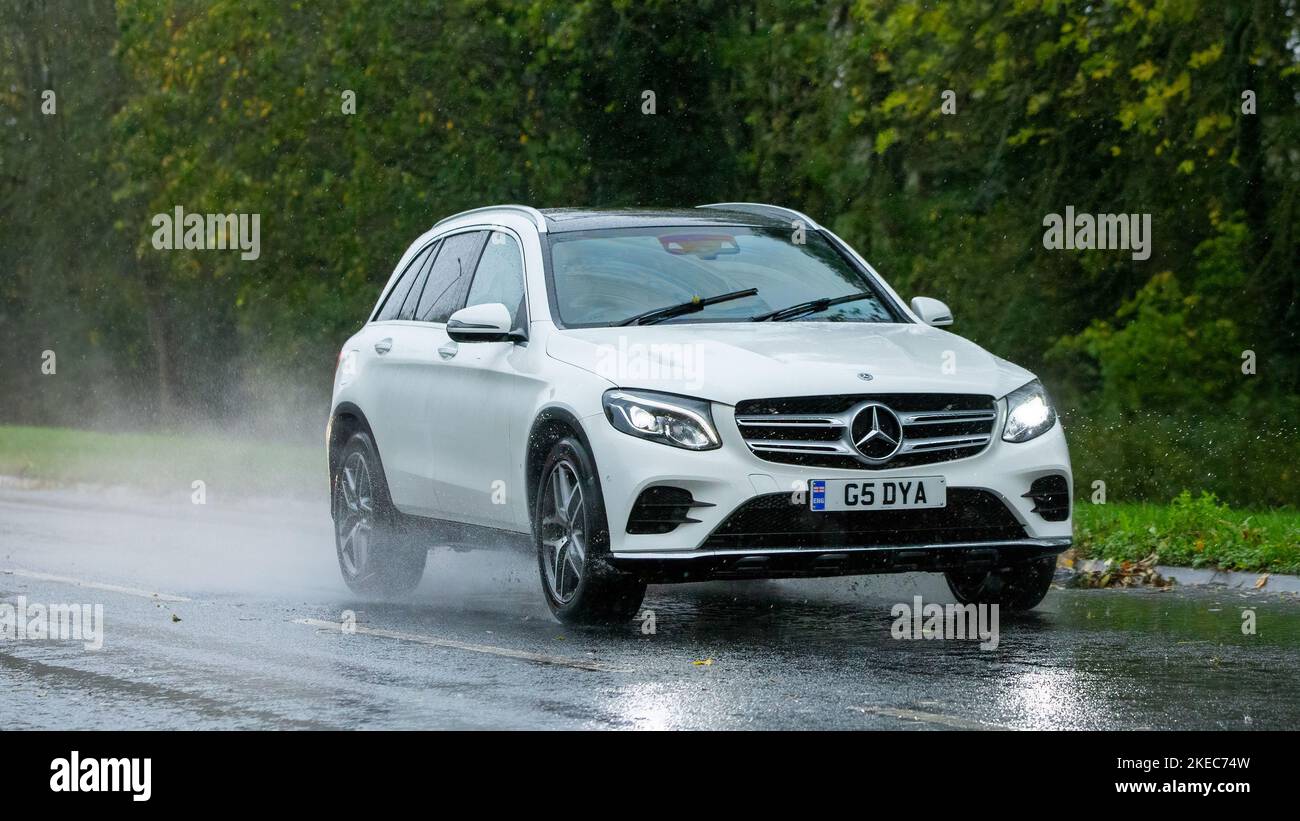 2017 Mercedes Benz GLC driving in the rain on a wet road Stock Photo ...