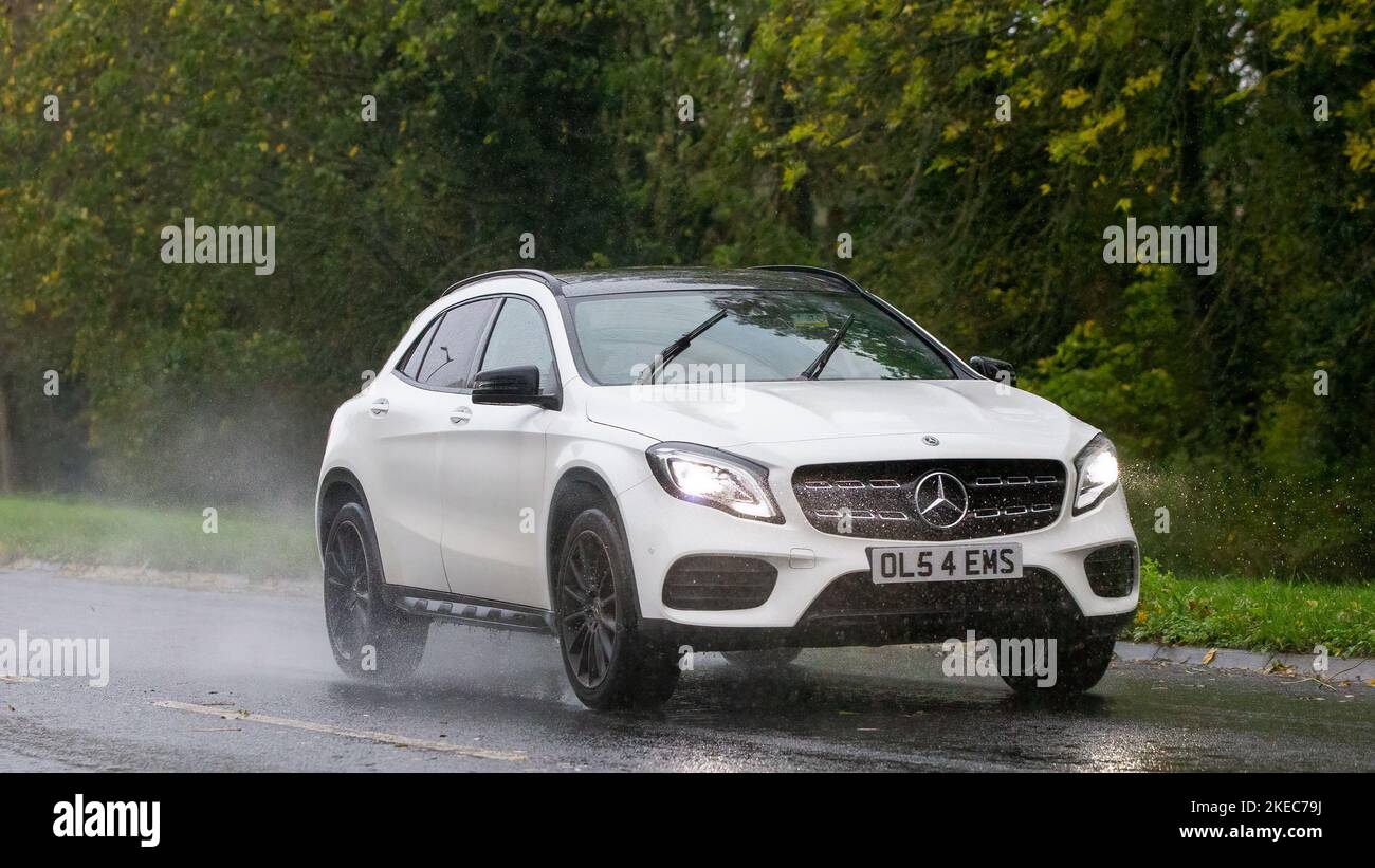 2019 white Mercedes Benz GLA driving in the rain on a wet road Stock ...