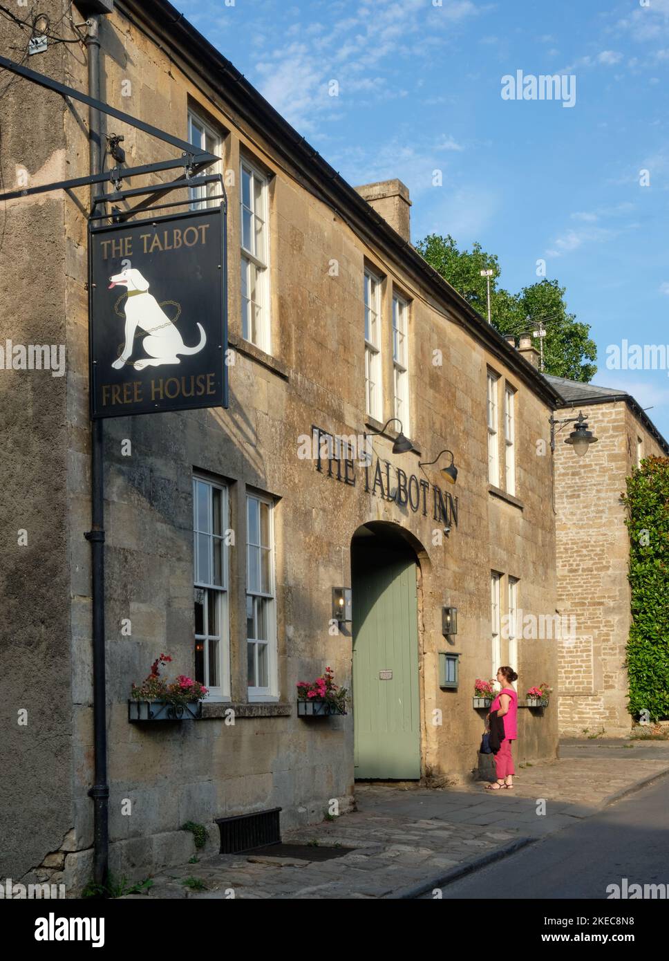 Talbot Inn Mells with customer looking at menu Stock Photo - Alamy