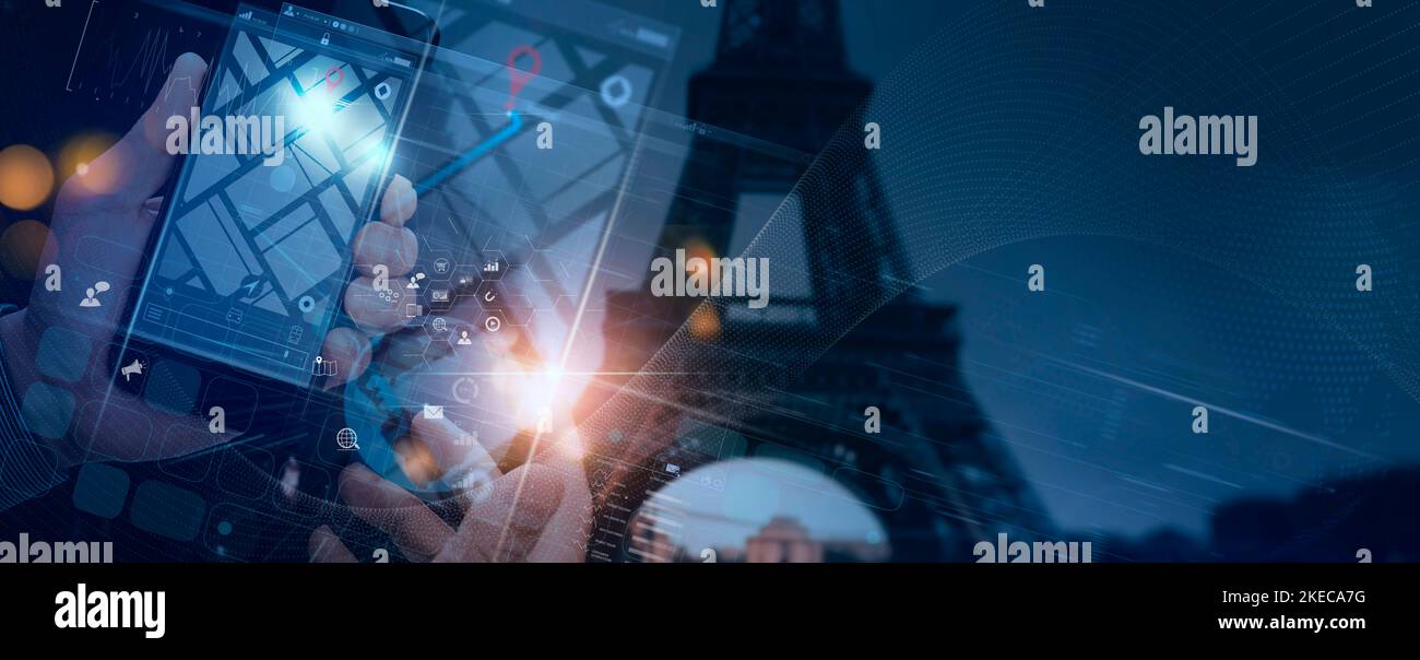 Tourist Hand holding a smartphone which displays Ui city map with ...