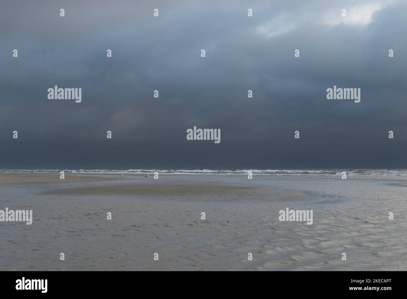 Dark rain clouds over the North Sea on Romo in Denmark Stock Photo - Alamy