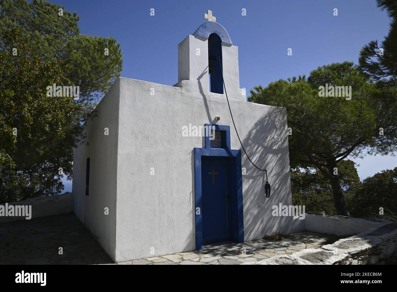 Landscape with scenic view of a traditional whitewashed Greek Orthodox ...