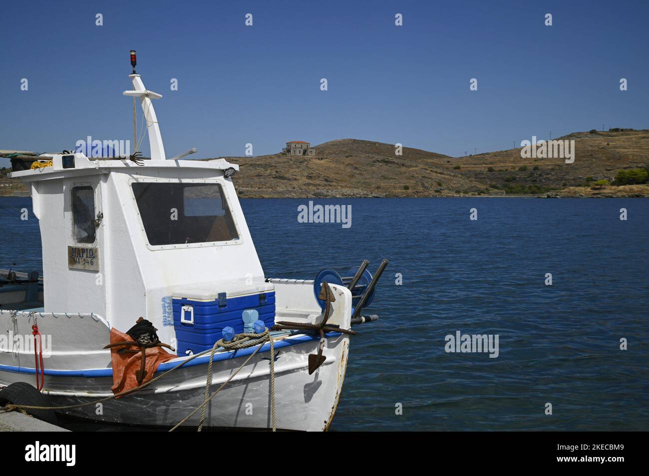 Landscape with scenic view of a traditional wooden Greek fishing boat ...