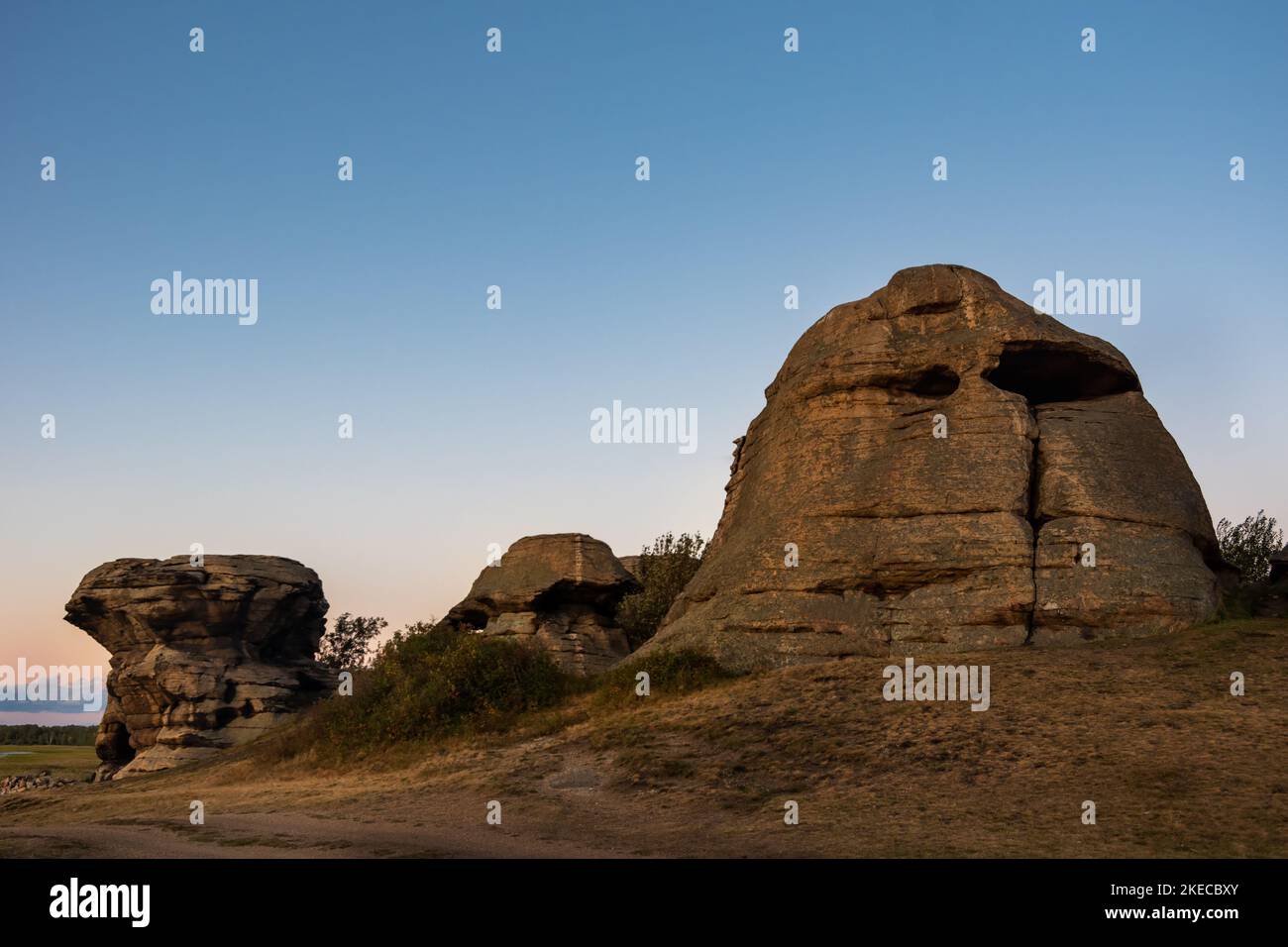 Sacred rocks, mountains in the shape of a head illuminated by the ...
