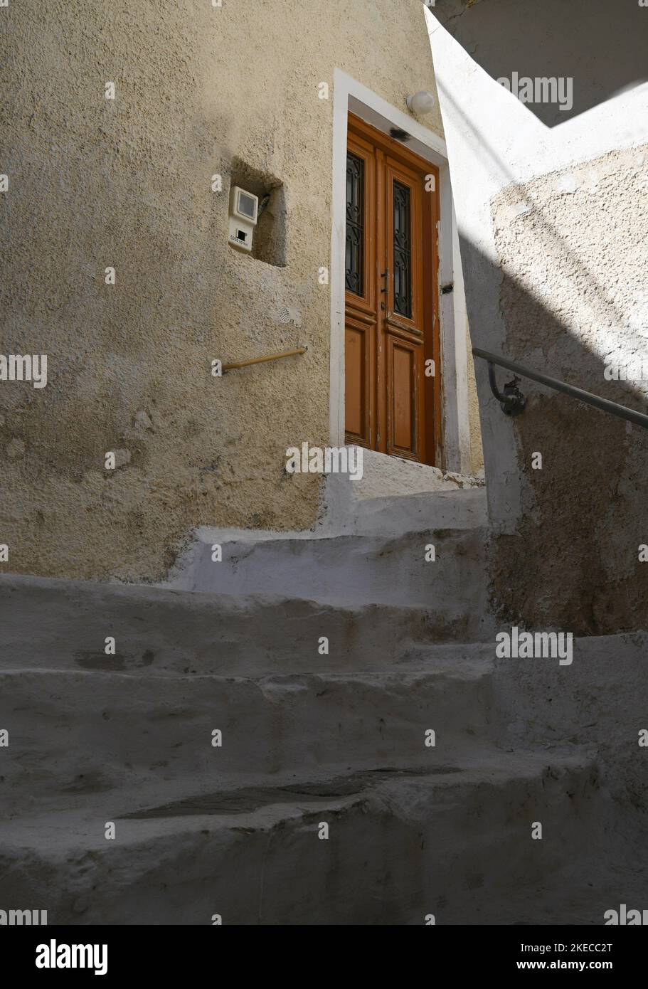 Old traditional rural house stone steps leading to a wooden entrance ...