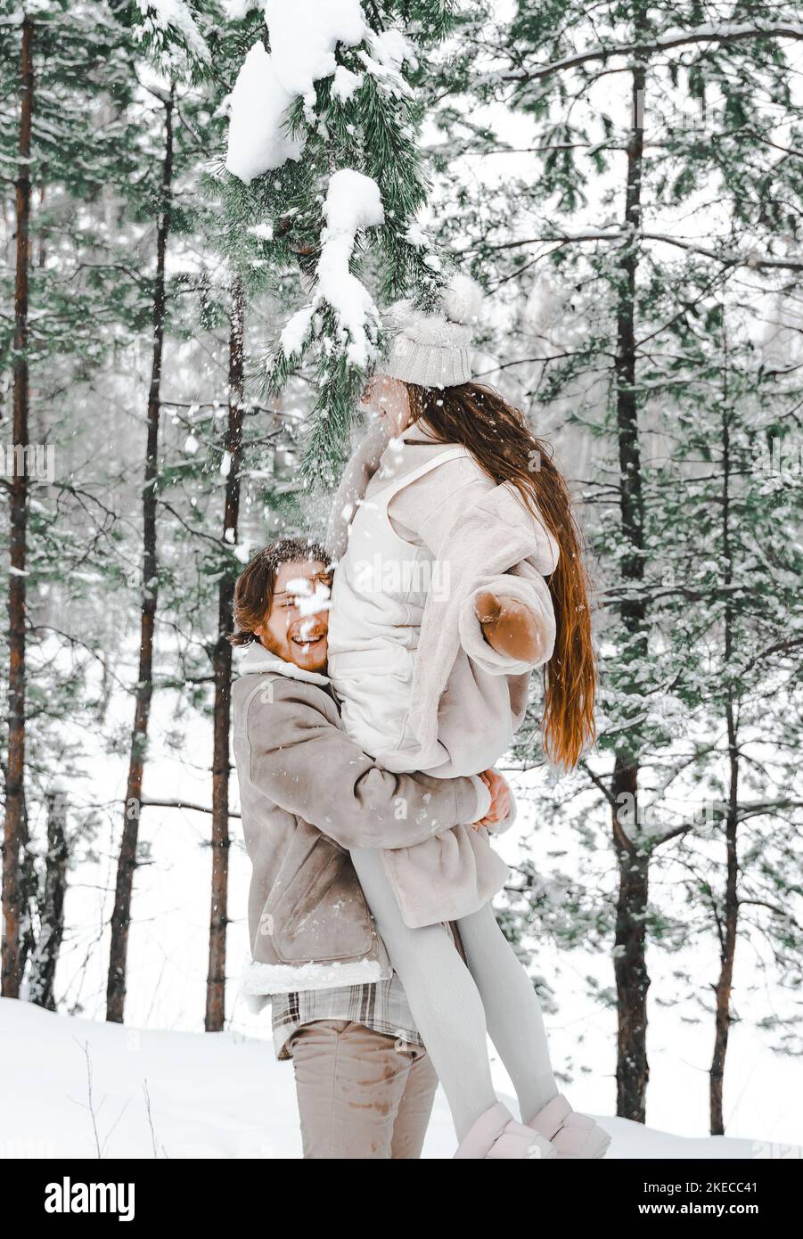 Romantic snow love story.Young couple guy girl lying,playing in snowy ...