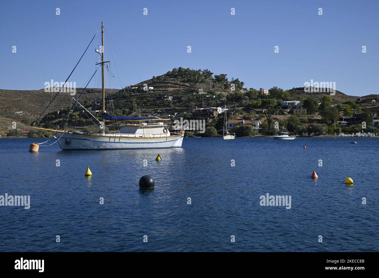 Landscape with scenic view of a traditional wooden Greek fishing boat ...