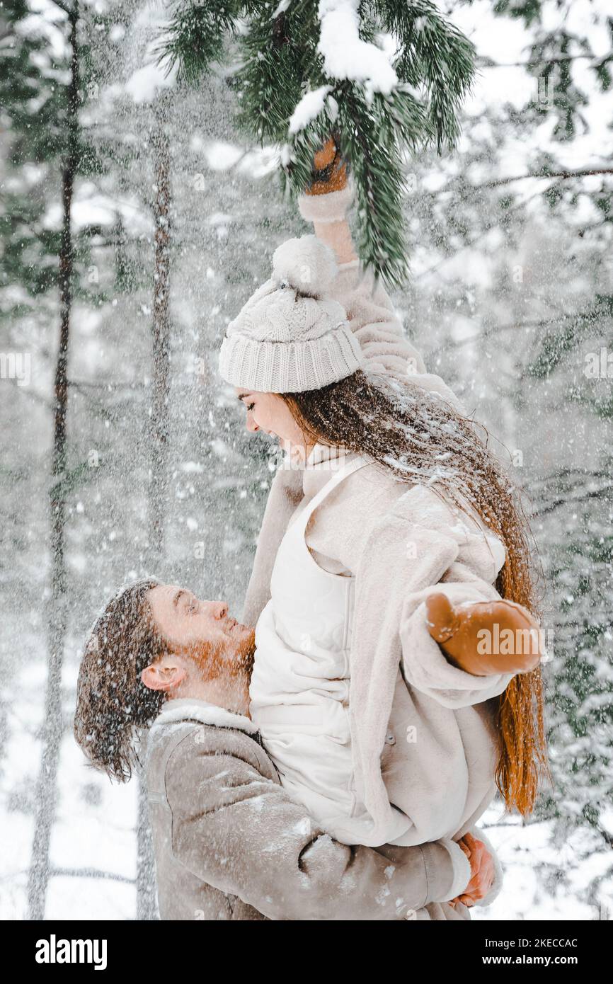 Romantic snow love story.Young couple guy girl lying,playing in snowy ...