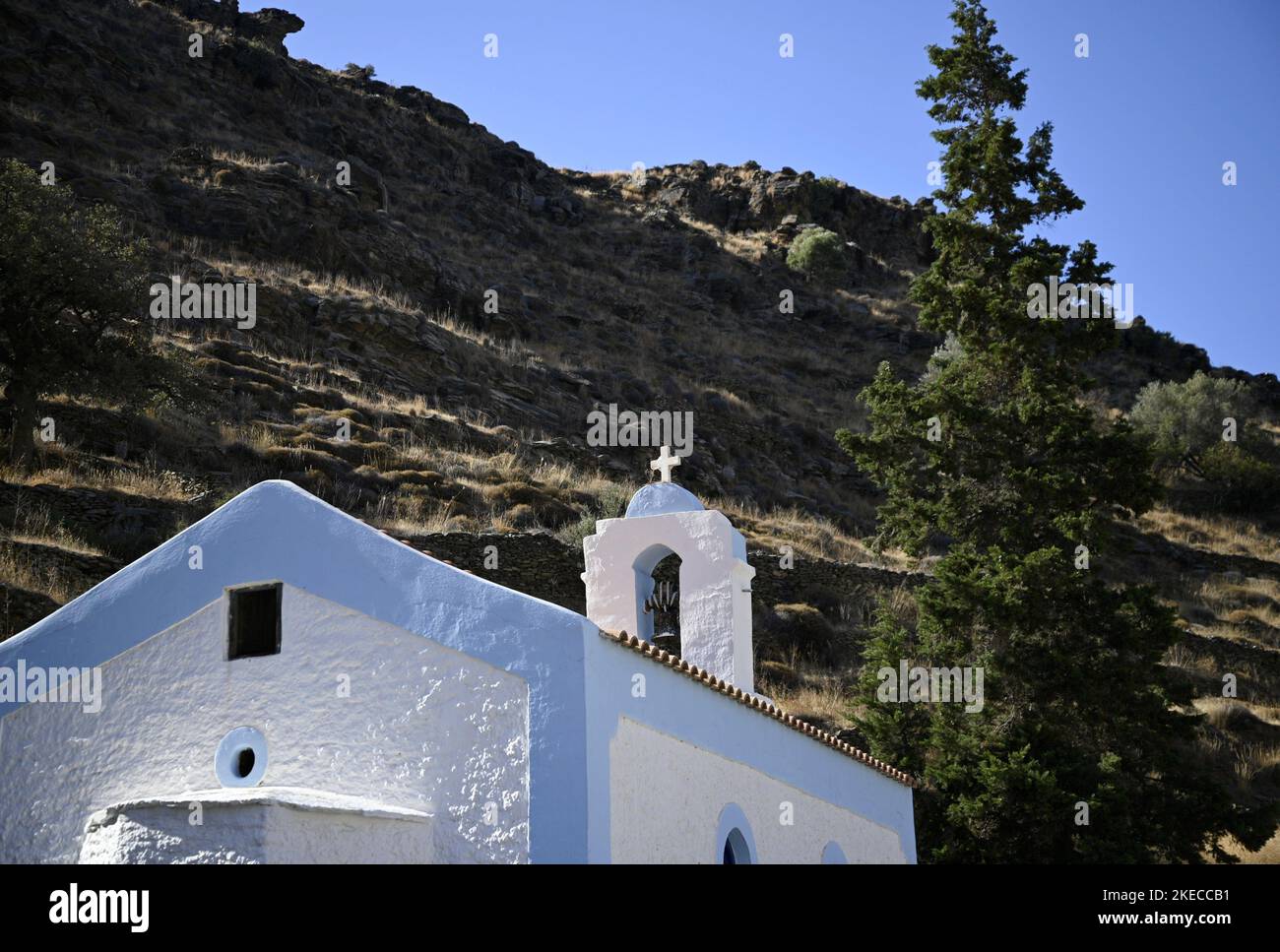 Old traditional rural house wooden window against a whitewashed wall ...
