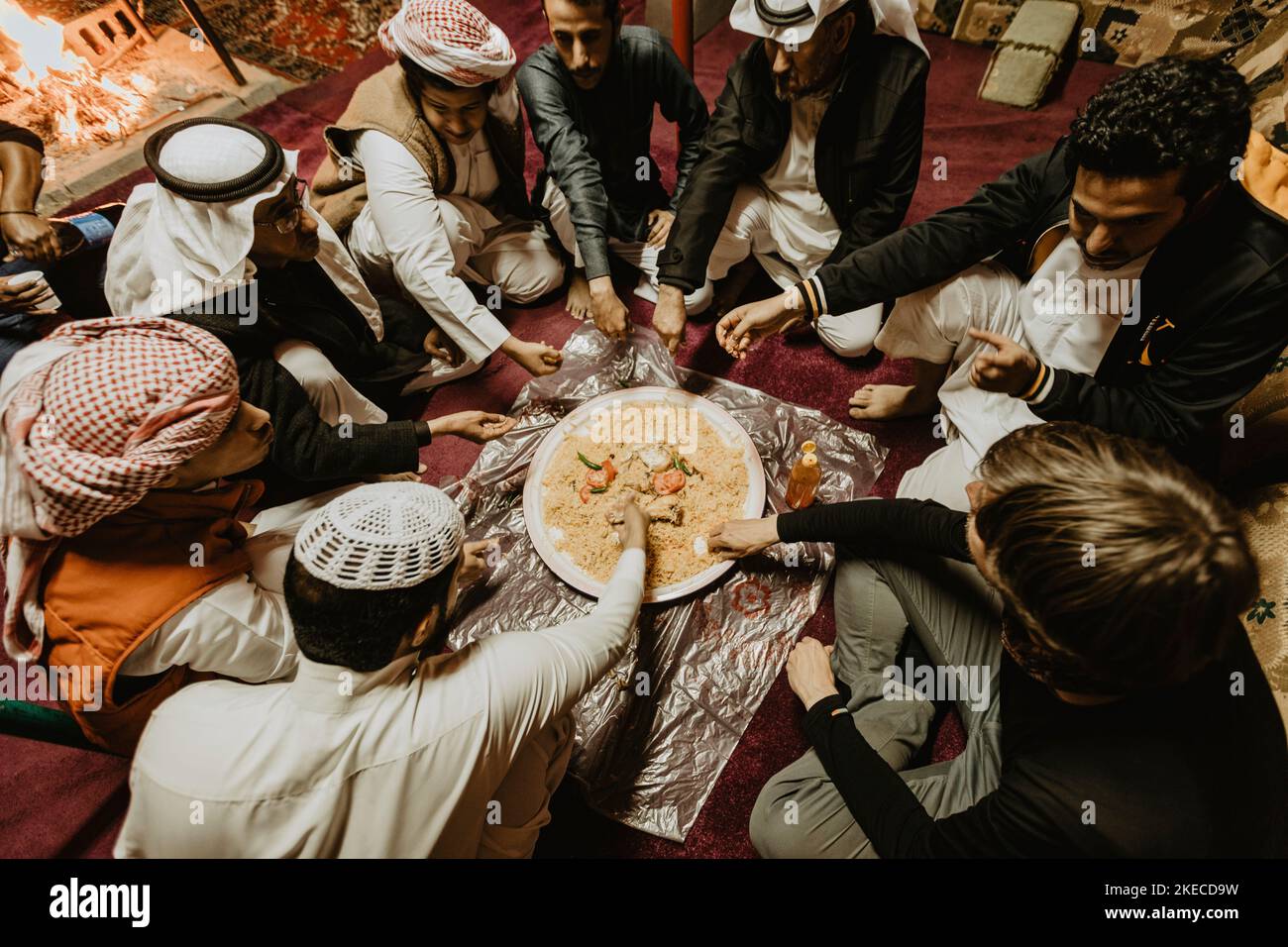 Saudi Arabia, Najran province, Najran, men, sit, eat Stock Photo - Alamy