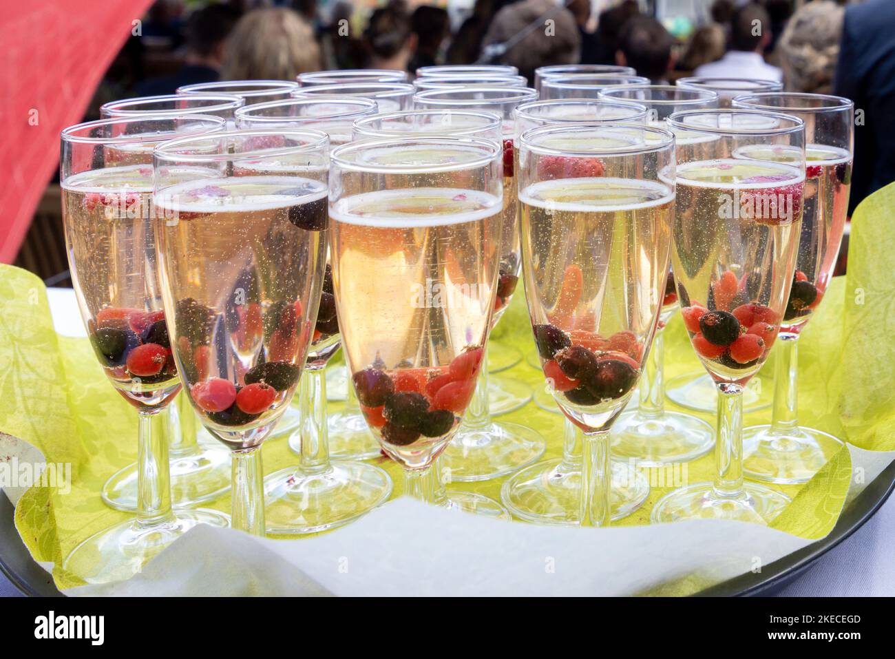 Sparkling and filled champagne glasses with fruits on a tray Stock ...