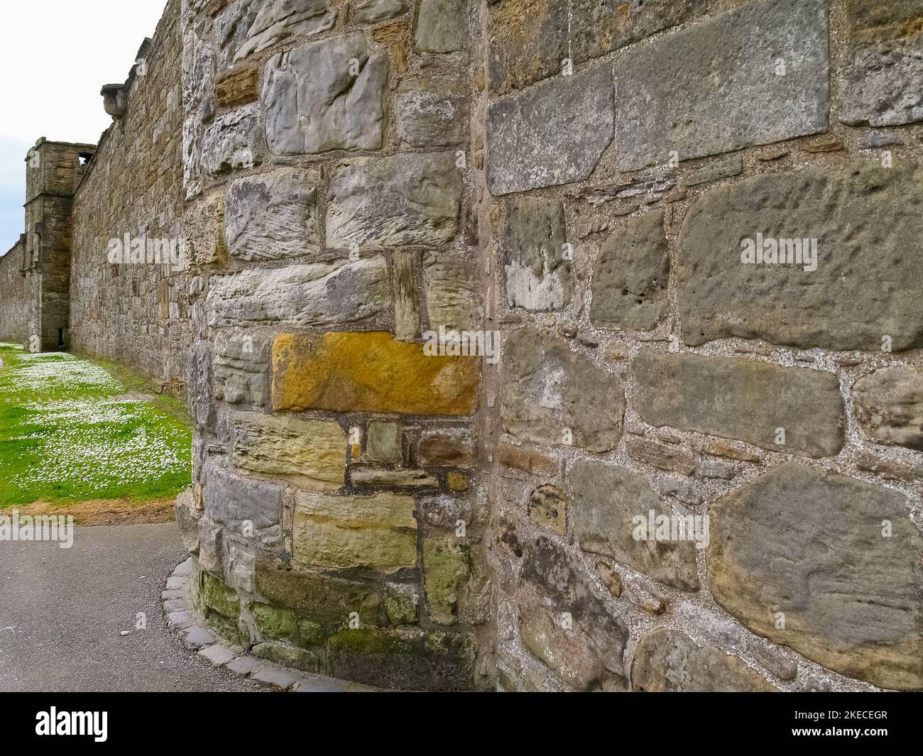 Solid medieval stone perimeter wall leading across landscape at St ...