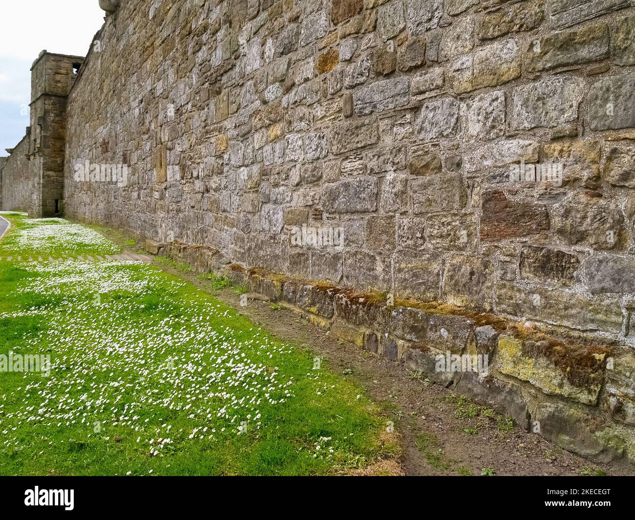 Solid medieval stone perimeter wall leading across landscape at St ...