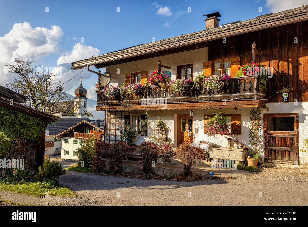 Farmhouse and St. Anna church in Wamberg. Garmisch-Partenkirchen ...