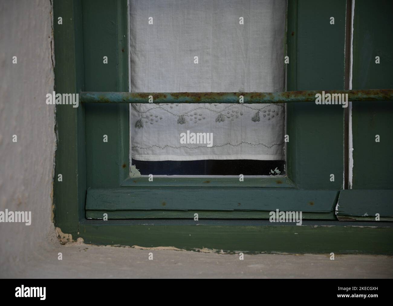 Old traditional rural house wooden window with handmade curtains ...