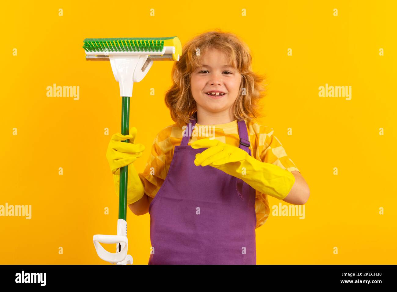 Child doing housework. Child cleans at home concept. Kid cleaning with ...