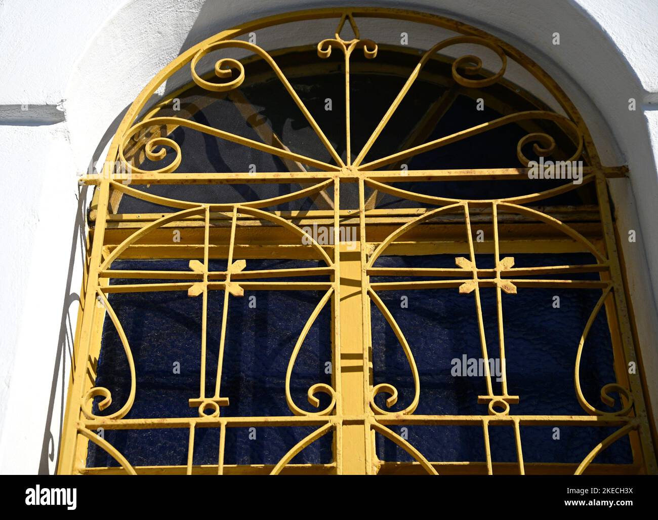 Traditional rural Greek Orthodox chapel window with handcrafted wrought ...