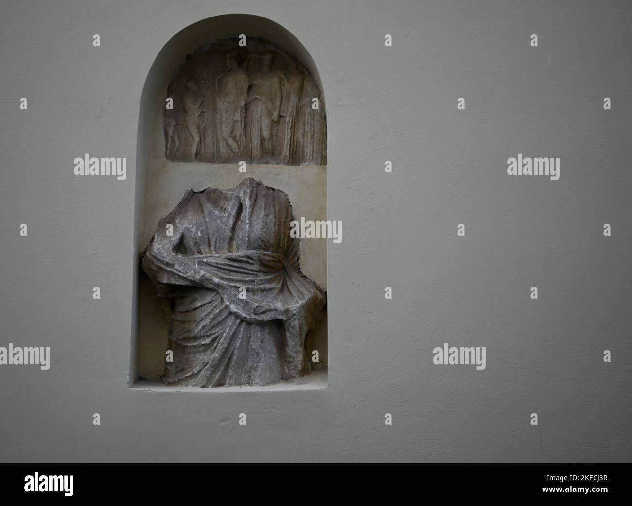 Greek classical stone sculpture on an arched wall recess in Kea island ...