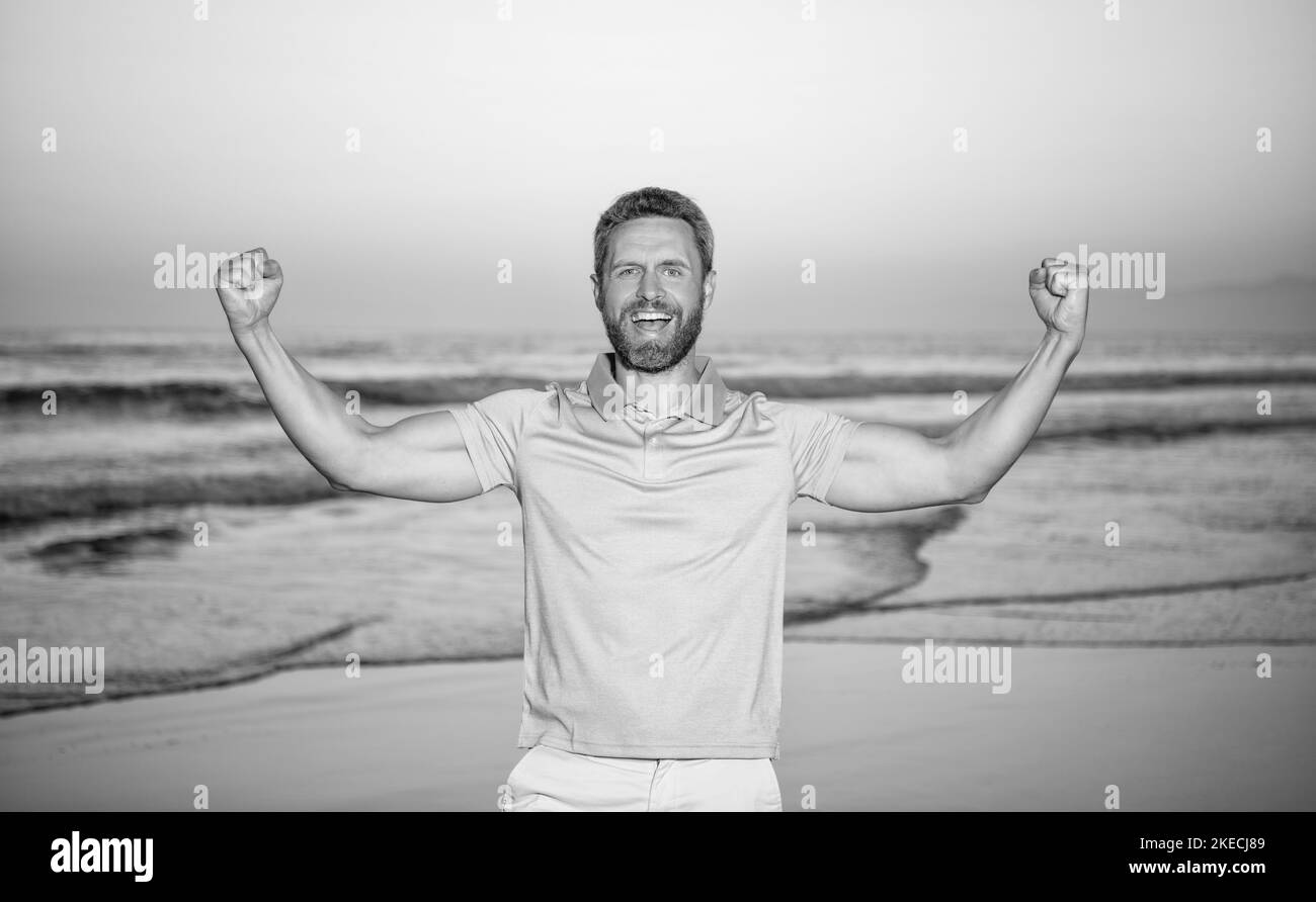 happy guy over the sea on sunrise summer beach, emotions Stock Photo ...