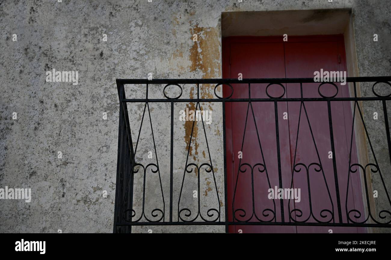 Old traditional rural house balcony with a handcrafted wrought iron ...