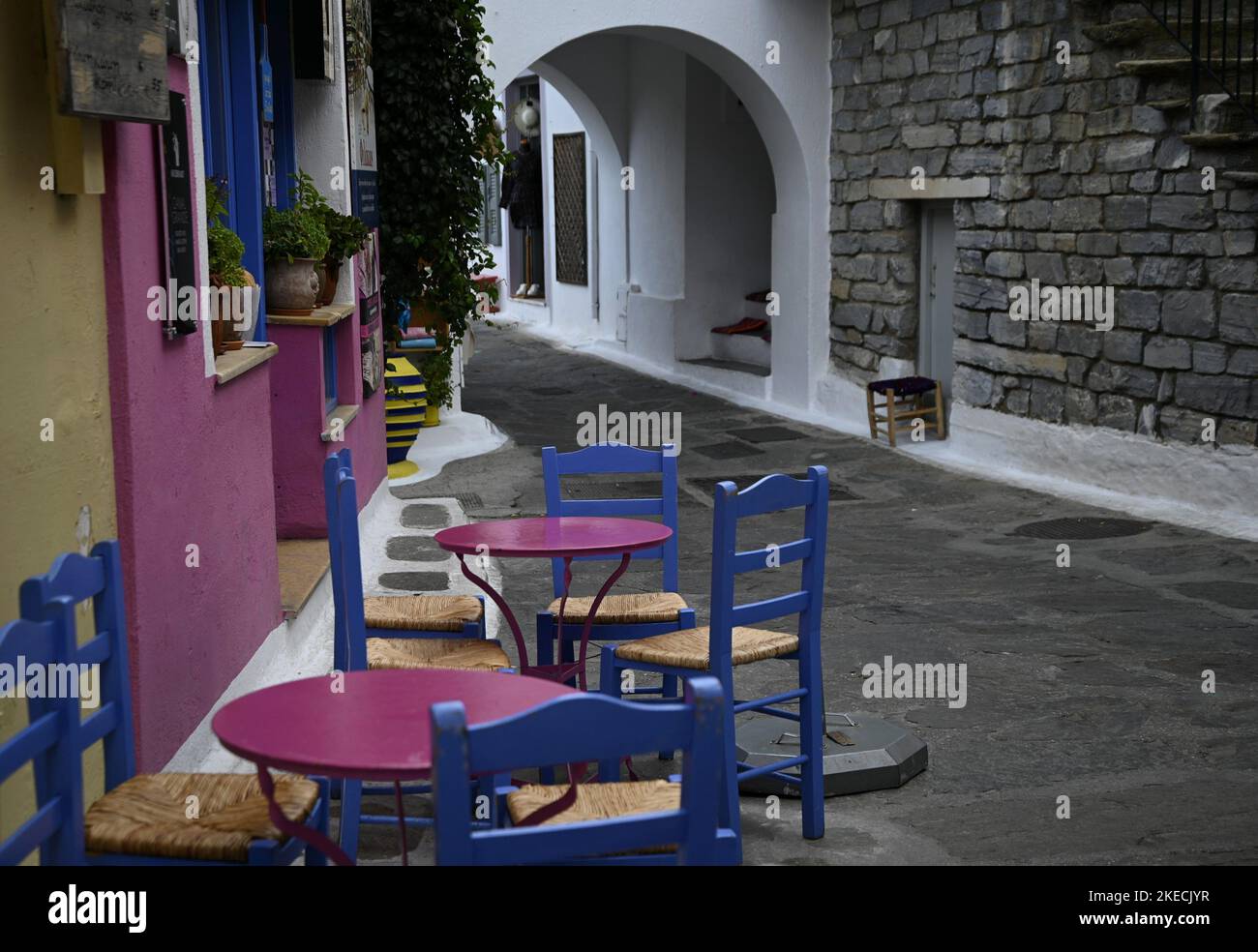 Traditional rural cafe patio with colorful bistro furniture in Kea ...
