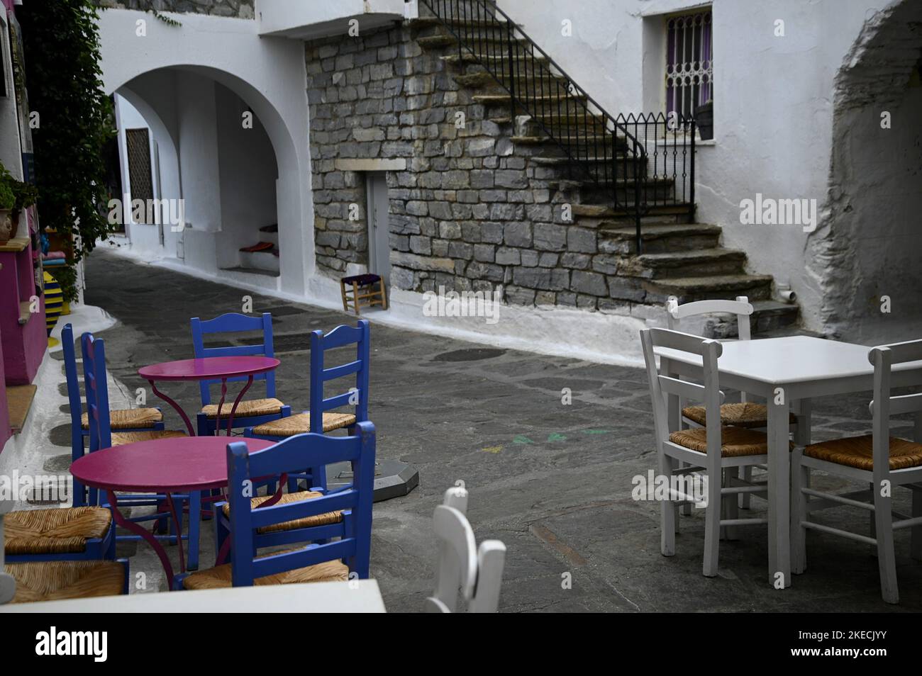 Traditional rural cafe patio with colorful bistro furniture in Kea ...