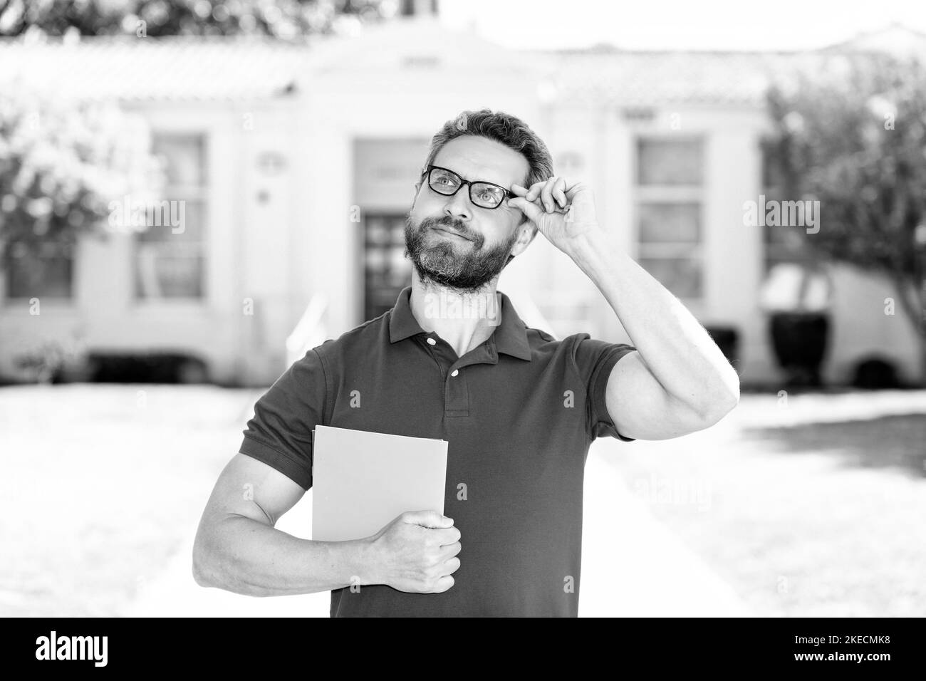 mature teacher nerd looking smart in eyeglasses with paper sheet ...