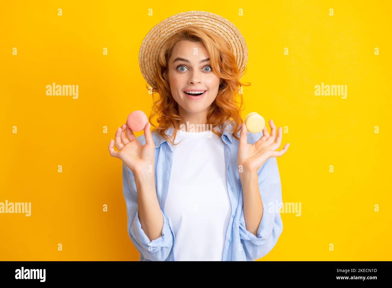 Beauty model girl taking colorful macaroons. Beautiful woman eating ...