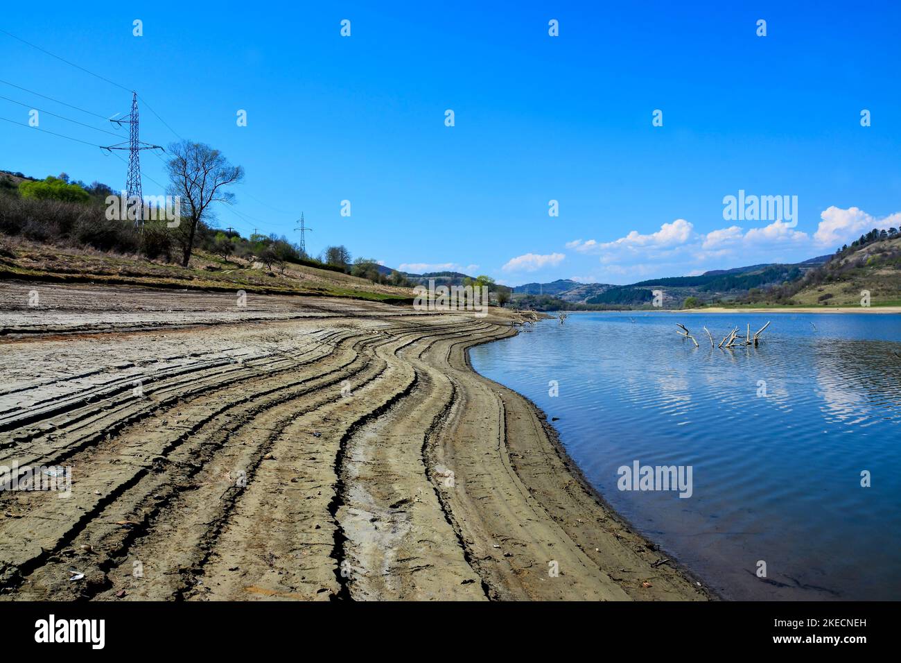 A scenic shot of the banks of a river during a drought with the bright ...