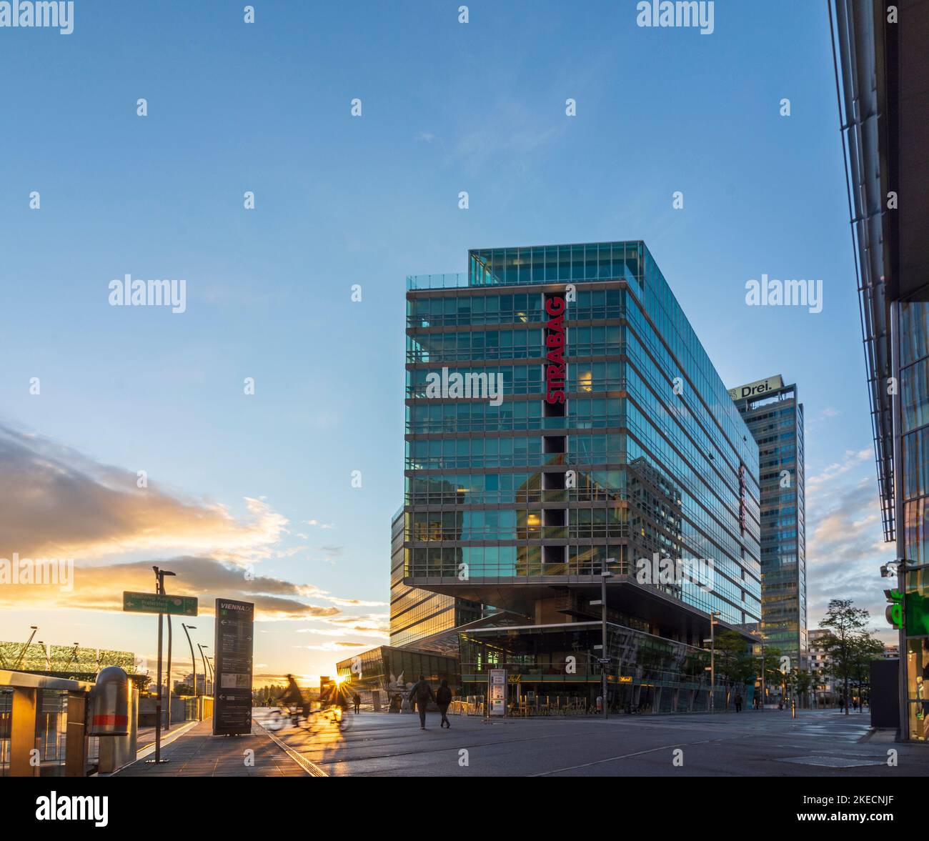 Vienna, Strabag Headquarters in Donaucity, pedestrians at sunset in 22 ...