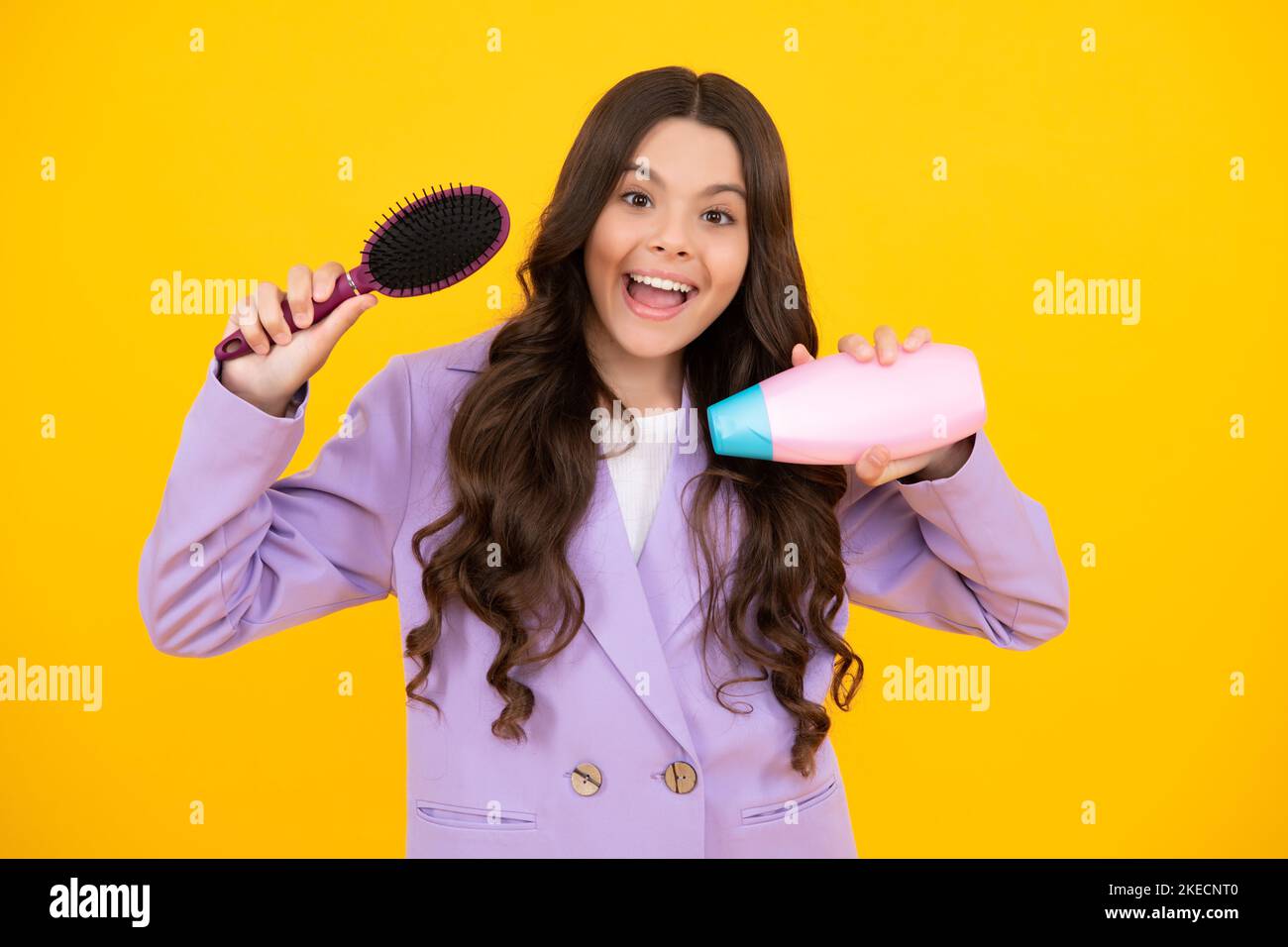 Teenage girl with shampoos conditioners or shower gel. Kids hair care ...