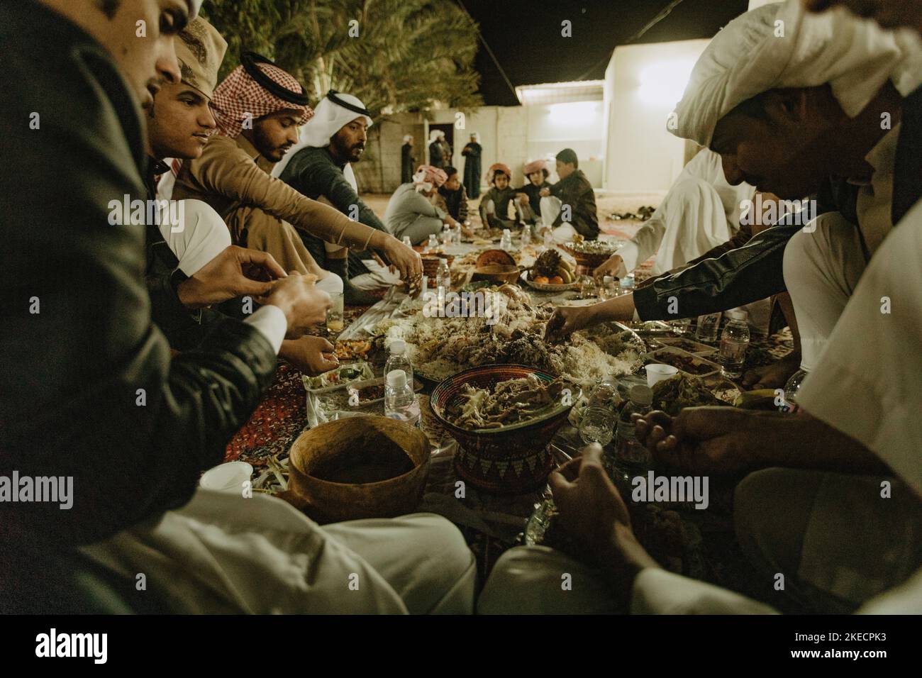 Saudi Arabia, Najran province, Najran, men, dinner Stock Photo - Alamy