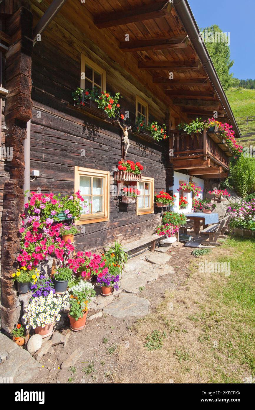Old farmhouse with flower decoration in South Tyrolean Ulten Valley ...