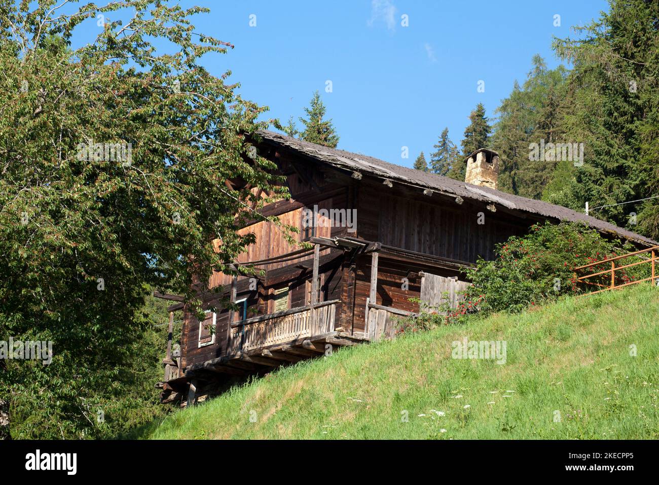Mountain farm on the steep mountain slope in the mountain meadows in ...