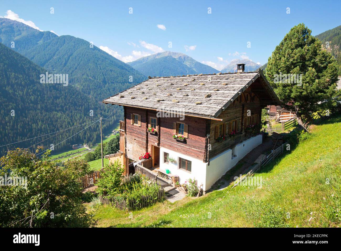 Mountain farm on the steep mountain slope in the mountain meadows in ...