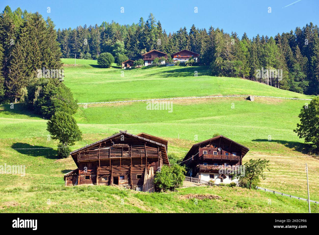 Mountain farm on the steep mountain slope in the mountain meadows in ...