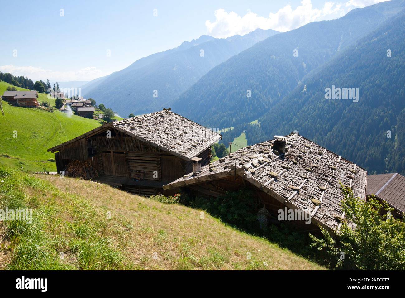 Mountain farm on the steep mountain slope in the mountain meadows in ...