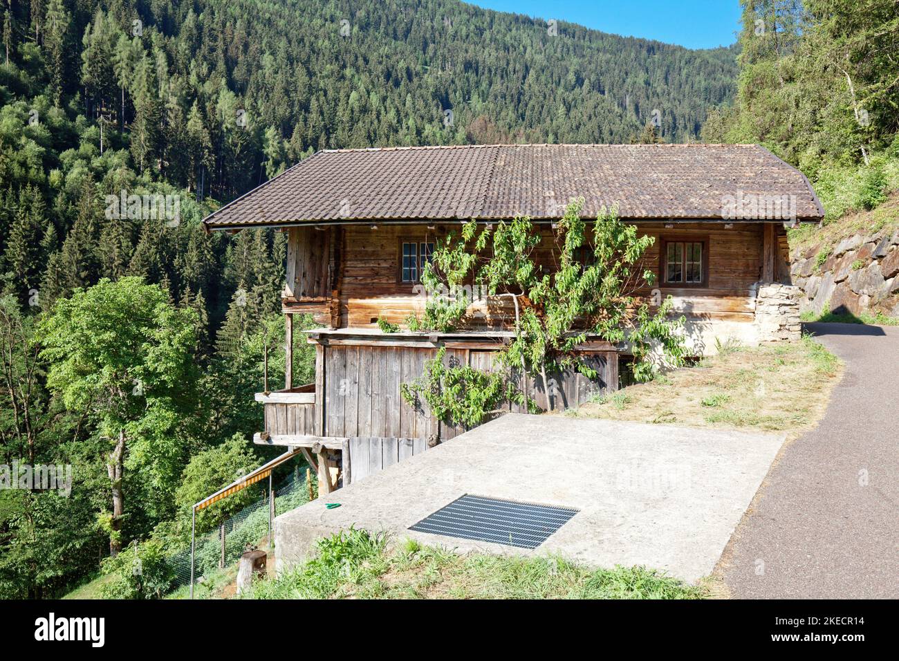 Mountain farmhouse was built into the steep slope, in the South ...