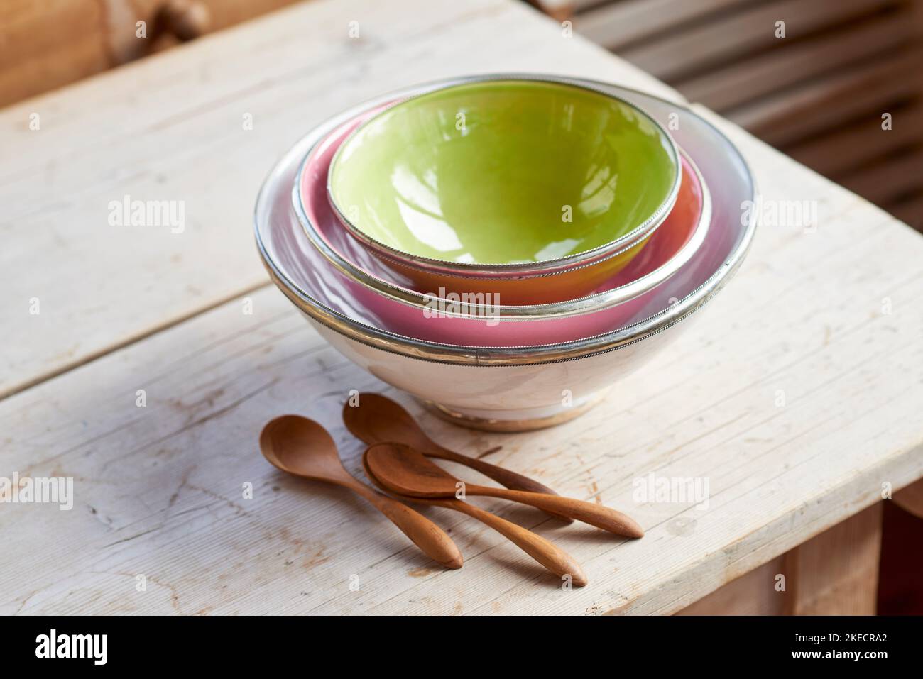 Bowls of different colors and sizes are stacked on top of each other on ...
