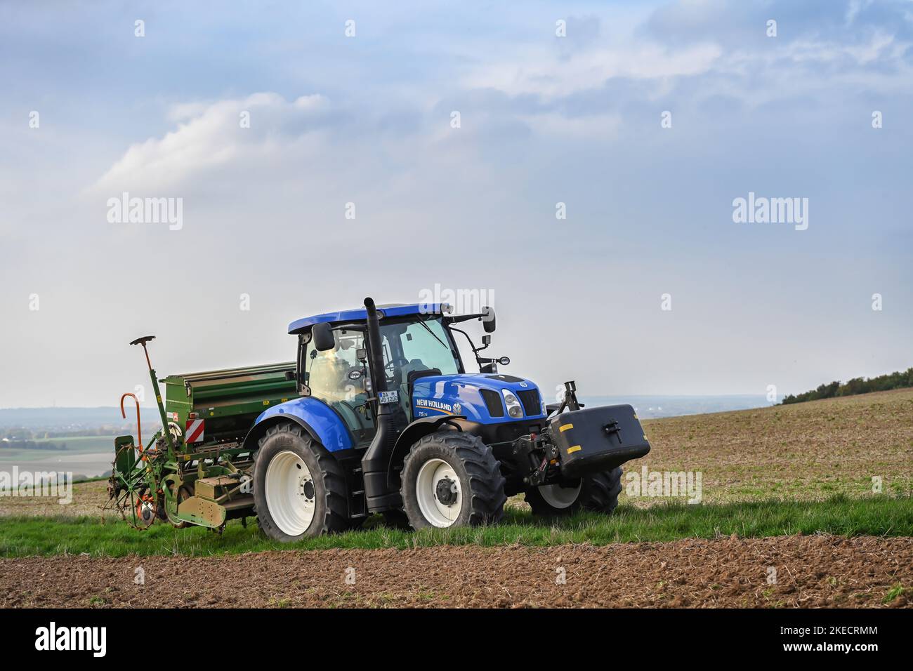 Hesse, Germany, tractor New Holland T6.175 with seed drill. Engine ...