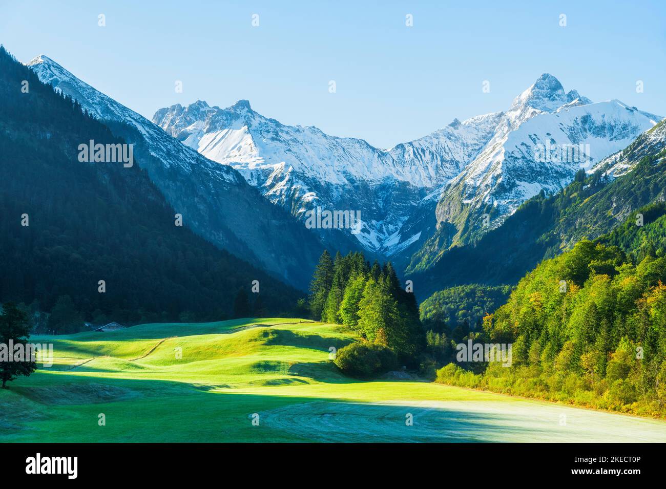Idyllic Trettach valley near Oberstdorf. Forests, meadows, snowy ...