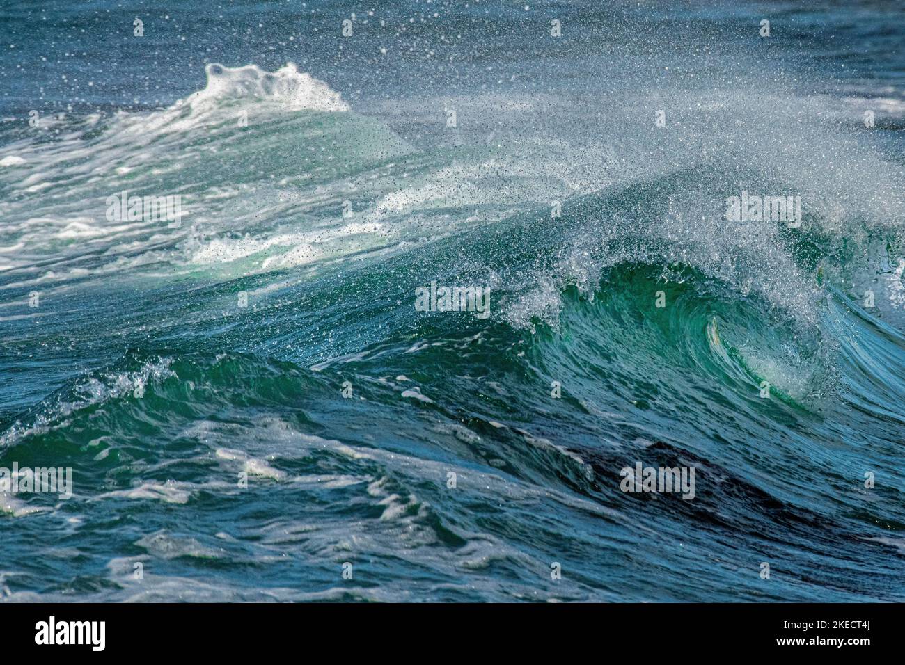 Ferocious Mediterranean waves crash onto the beach in the summertime ...