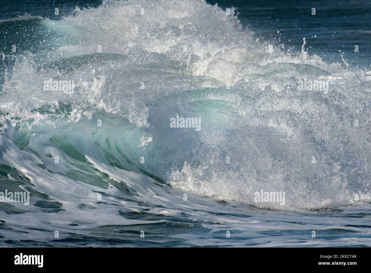 Ferocious Mediterranean waves crash onto the beach in the summertime ...