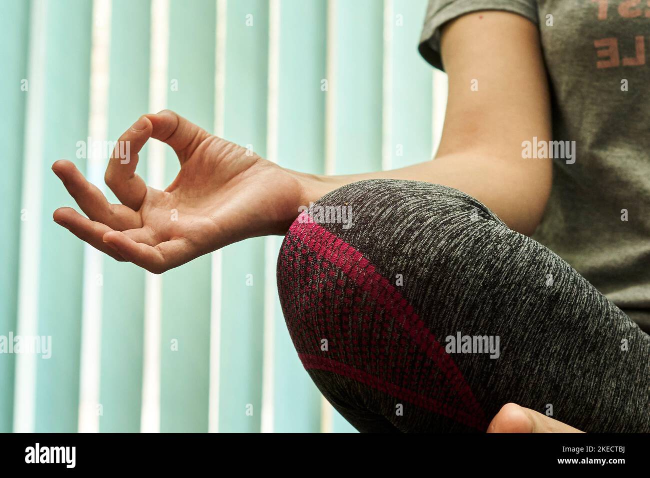 someone doing yoga with their hands in the air while they are sitting ...