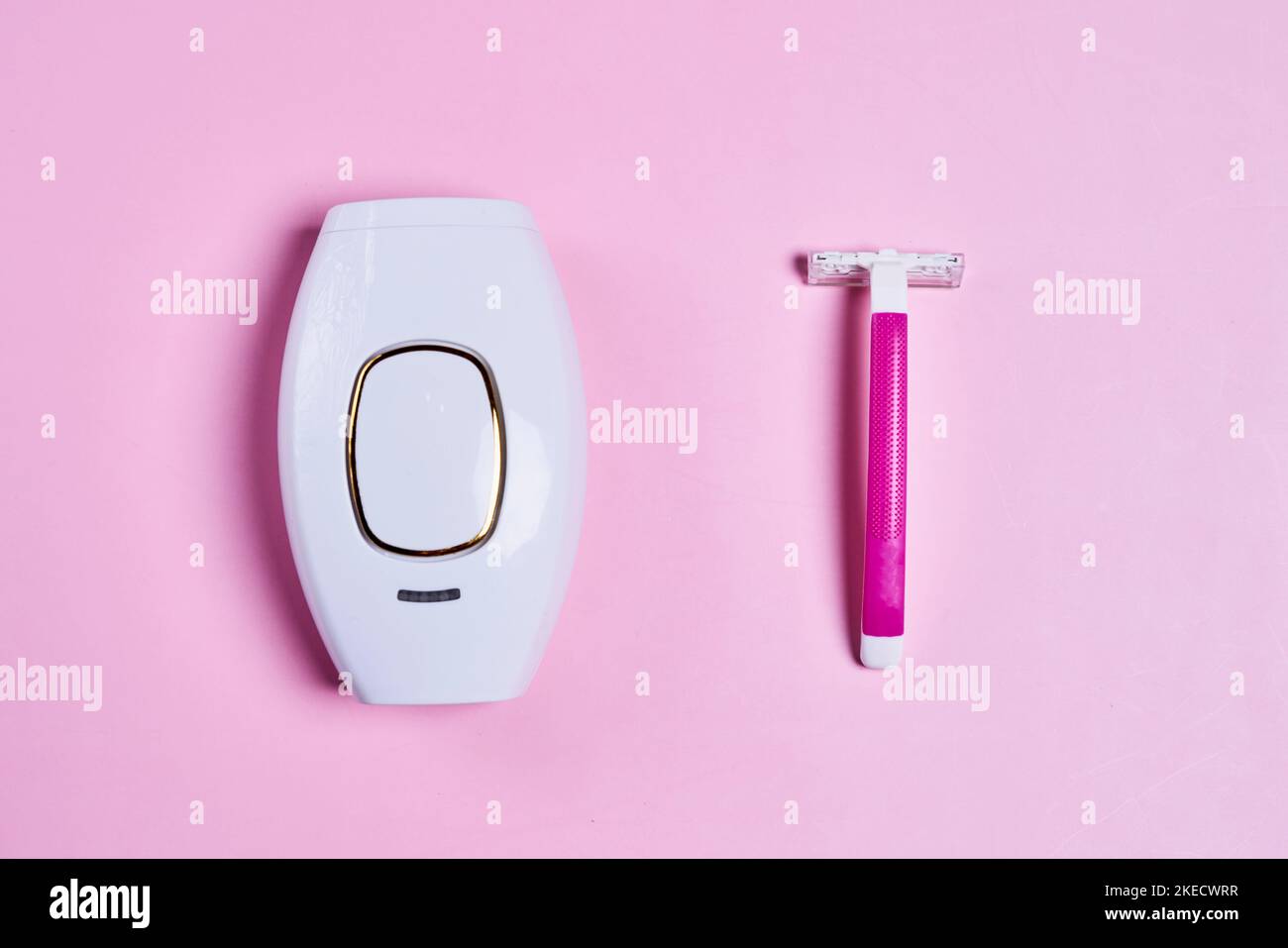 an electric toothbrush next to a razor brush on a pink background with ...
