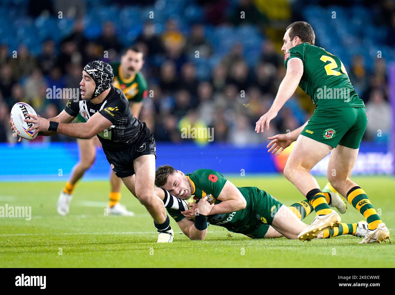 New Zealand's Jahrome Hughes (left) is tackled by Australia's Angus ...