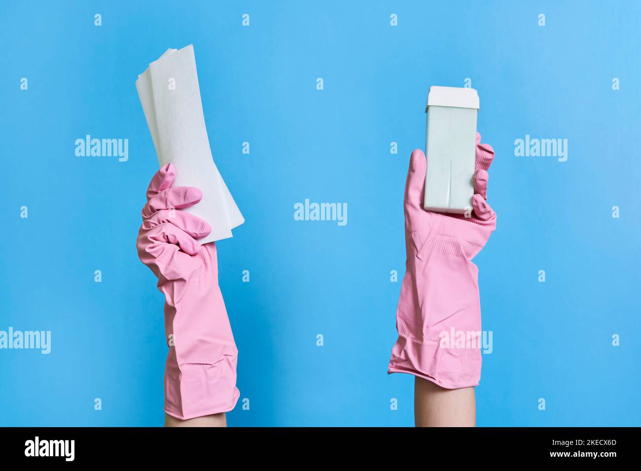 someone's hands holding a piece of paper in front of their face, with ...