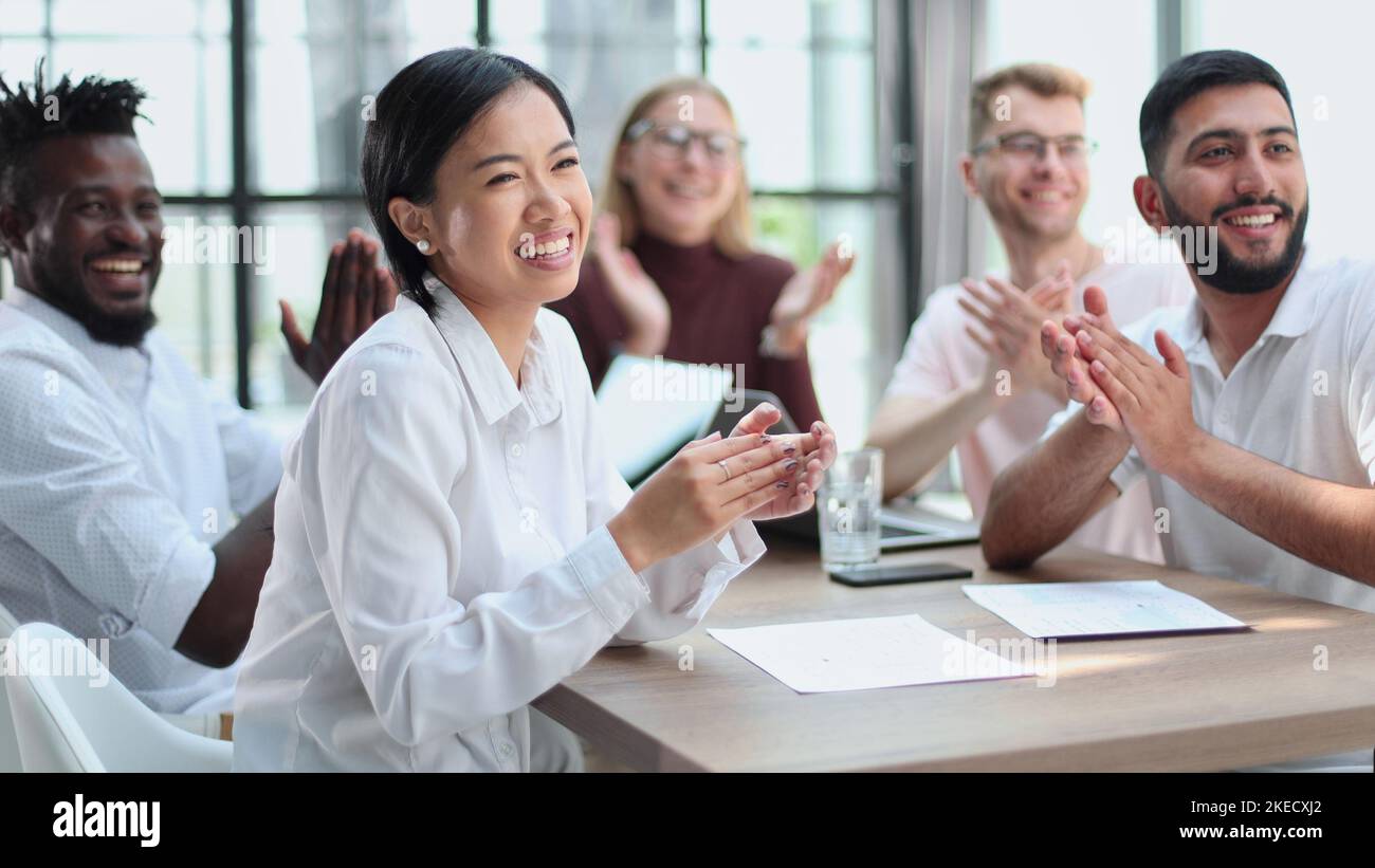Diverse business team smiling to camera in office Stock Photo - Alamy